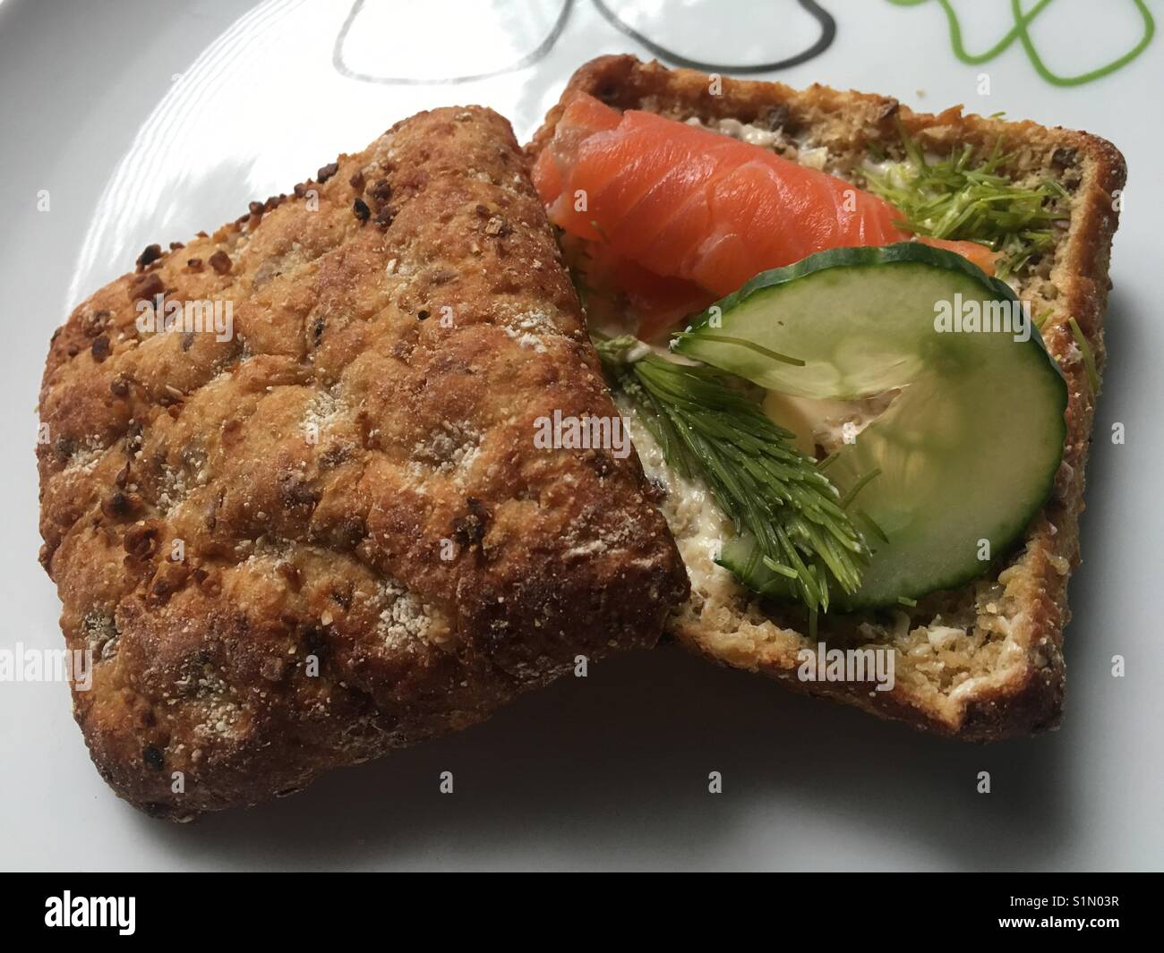 Salmon bread with cucumber Stock Photo - Alamy