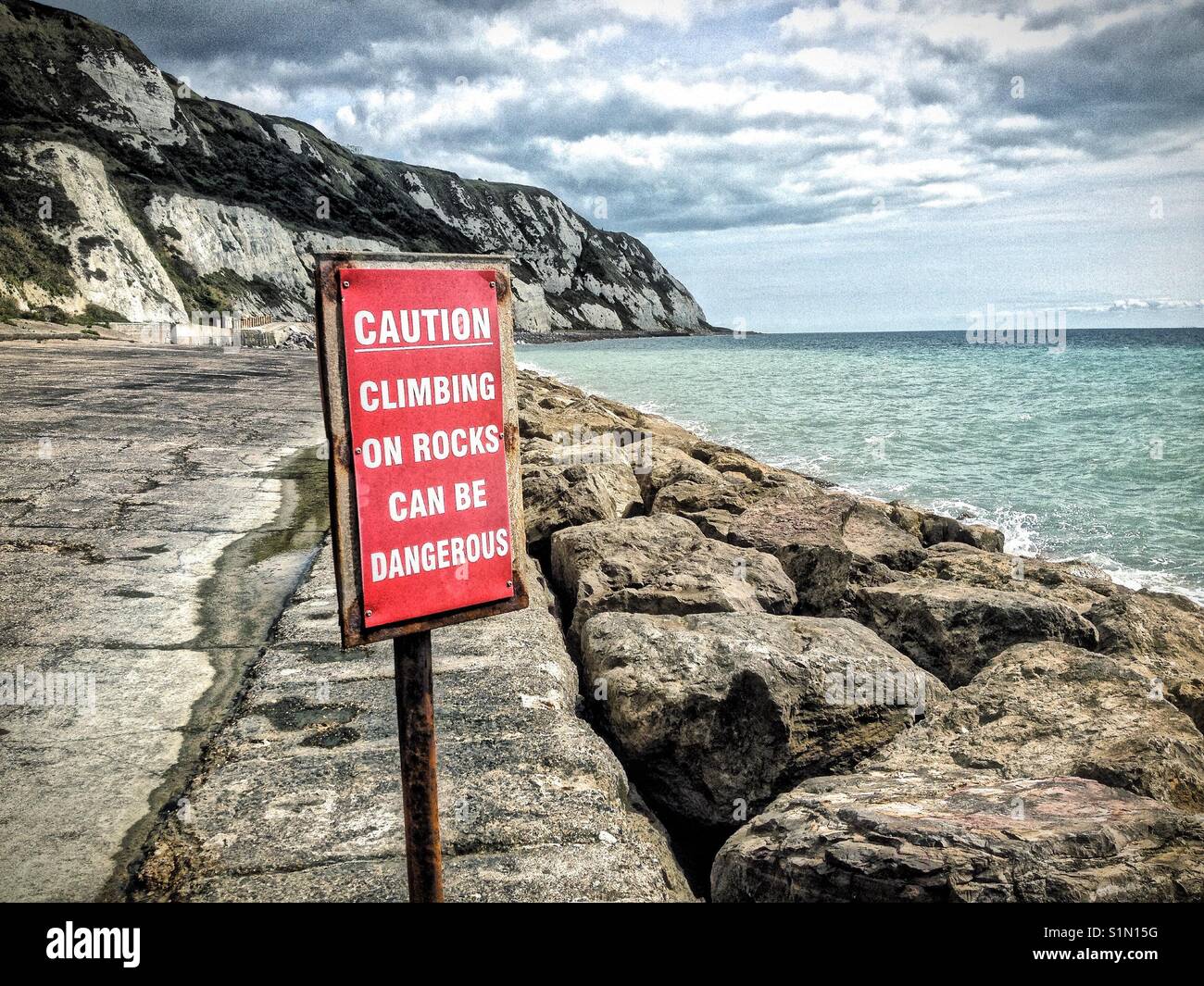 Caution Climbing On Rocks can be Dangerous Stock Photo - Alamy