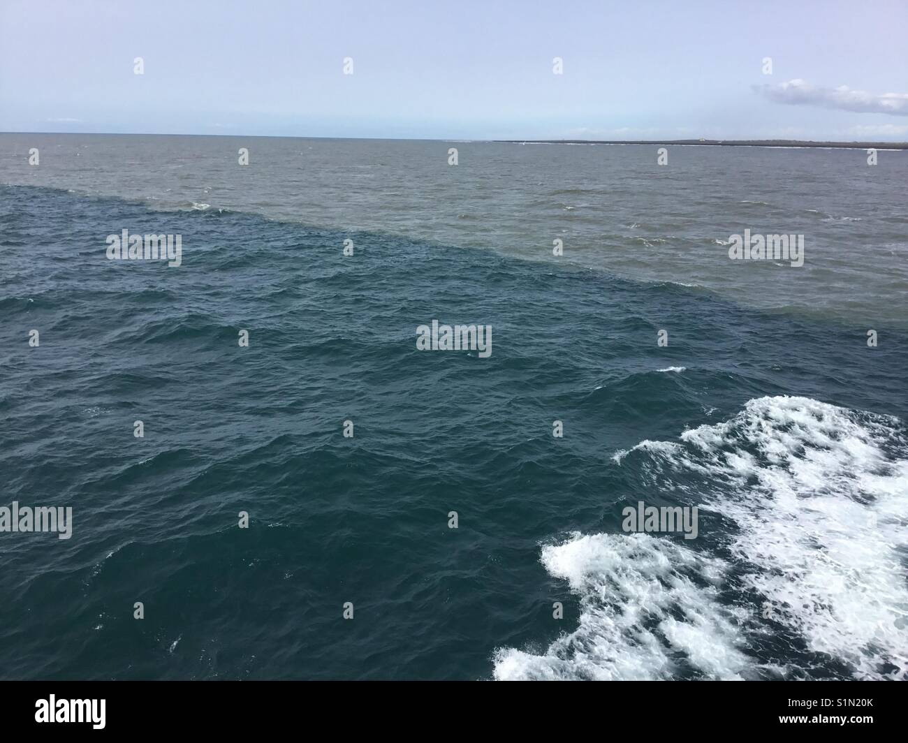 Two colors of the ocean near Iceland Stock Photo - Alamy