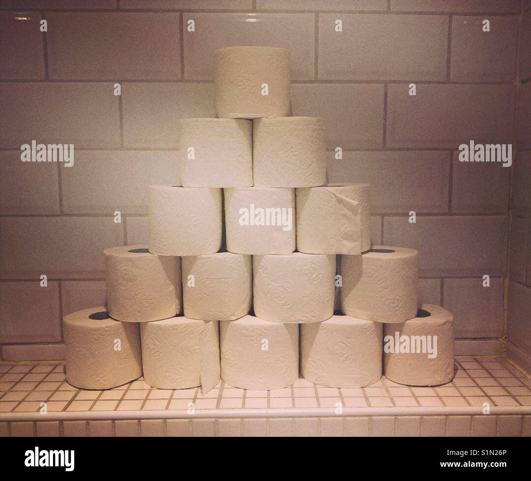 Toilet paper rolls stacked in pyramid form Stock Photo - Alamy