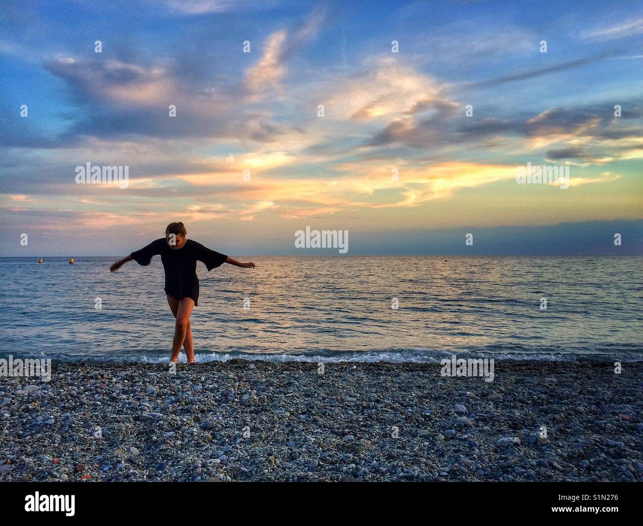 Girl on the beach Deiva Marina Italy Stock Photo - Alamy