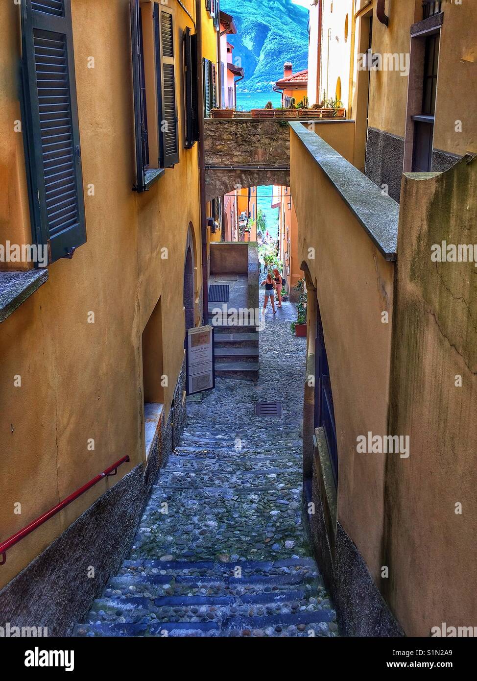 Looking down an alleyway in Varenna Italy towards lake Como Stock Photo ...