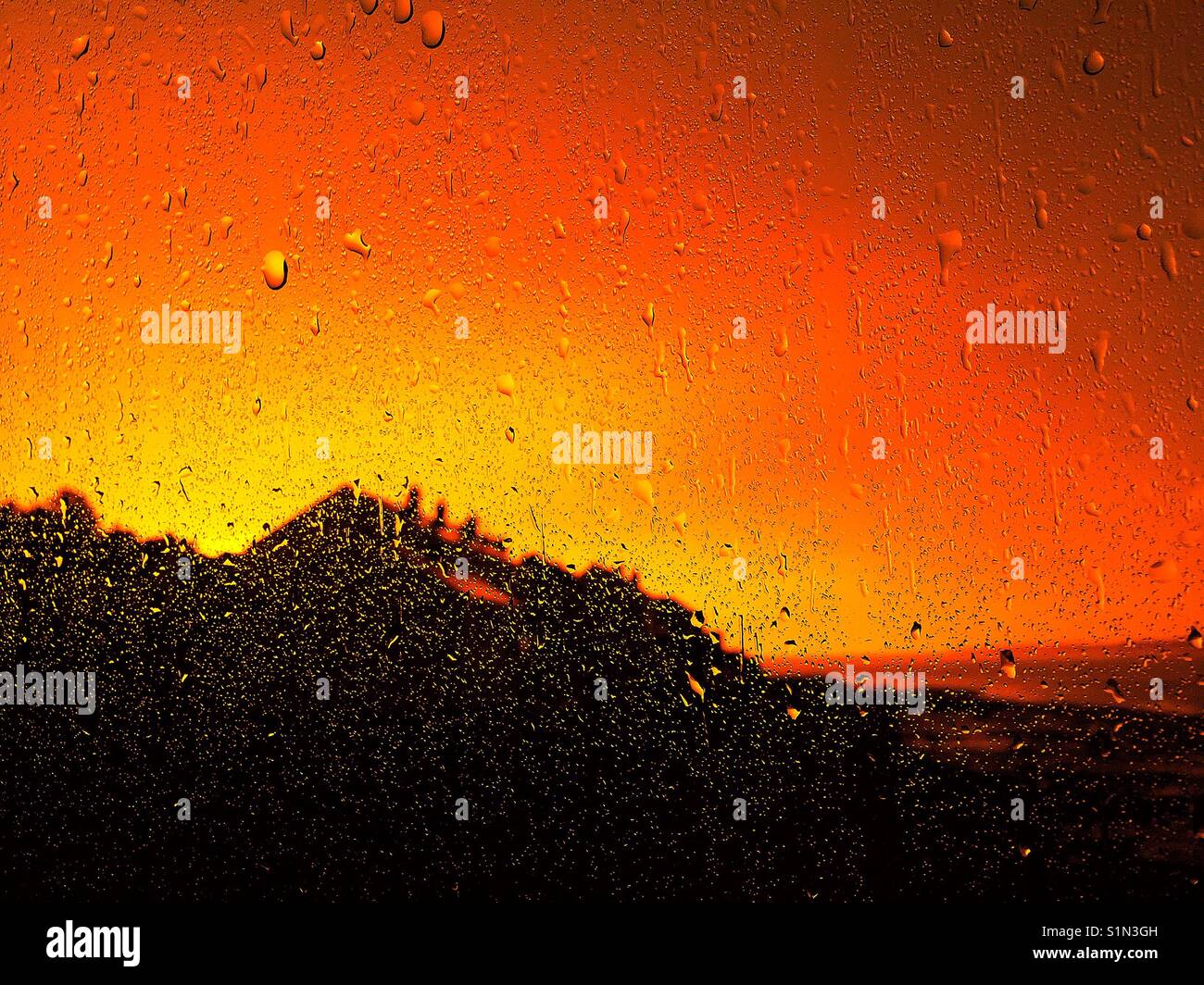 Sunset through a rainy window Stock Photo - Alamy