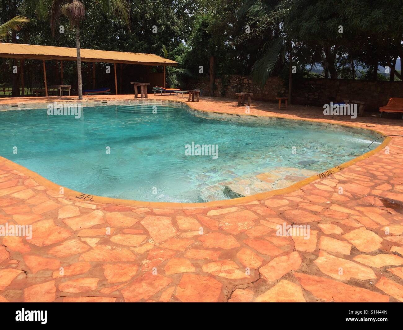 Swimming pool built from rocks at Eden Rock Resort at Bujjagali, Jinja ...