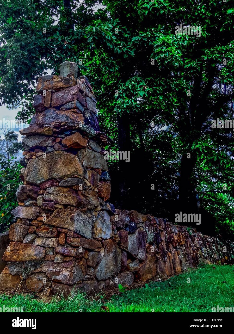 Texture and color in old dry stacked rock wall and column in historic ...