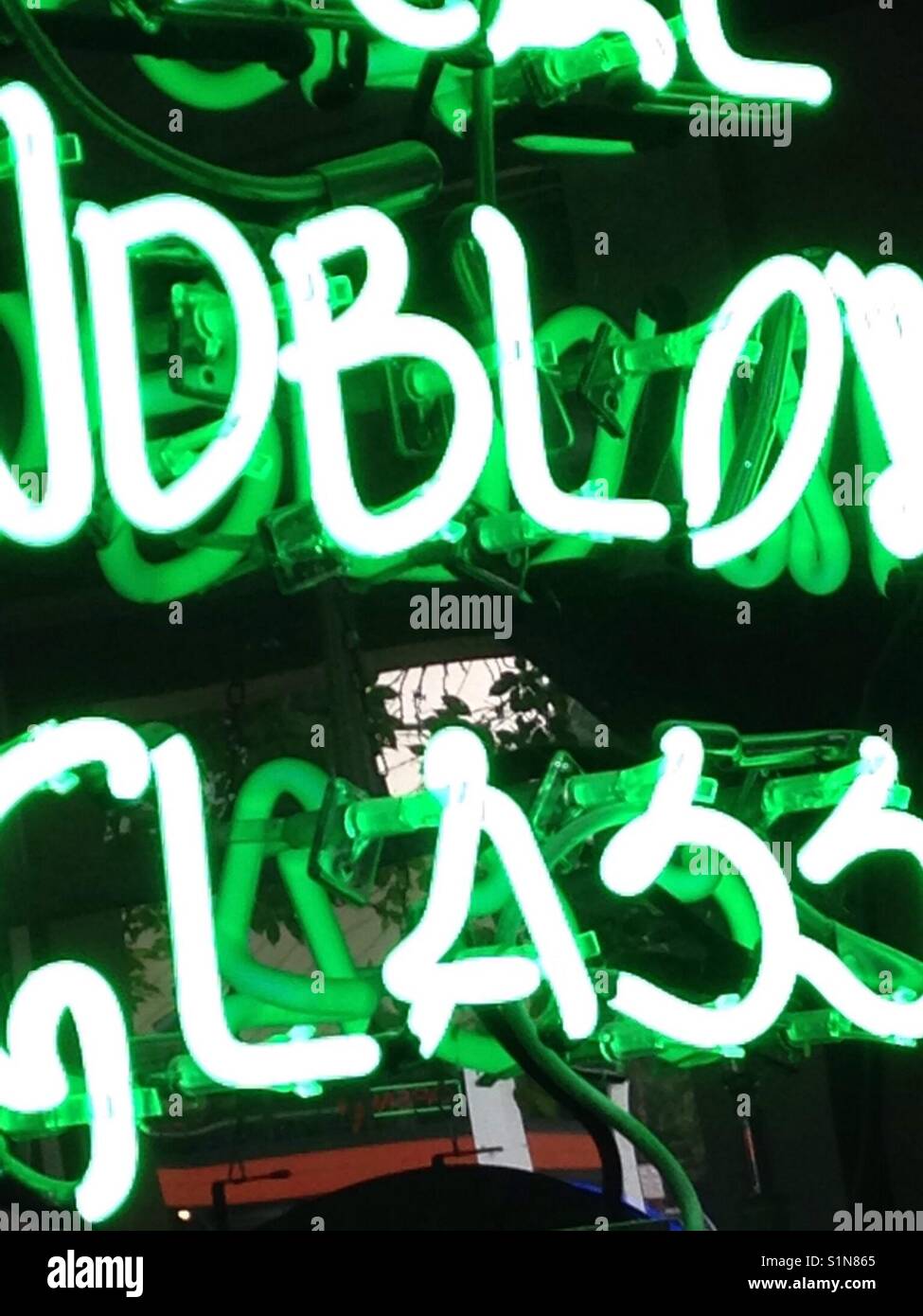 Neon sign on a mirror - extreme close up Stock Photo - Alamy