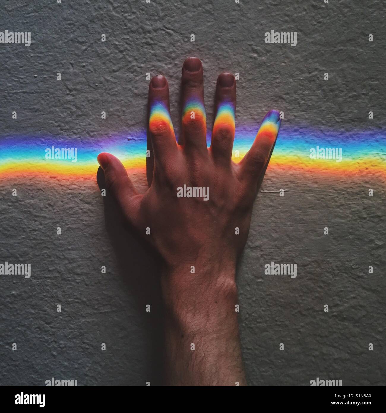 Hand rainbow hi-res stock photography and images - Alamy