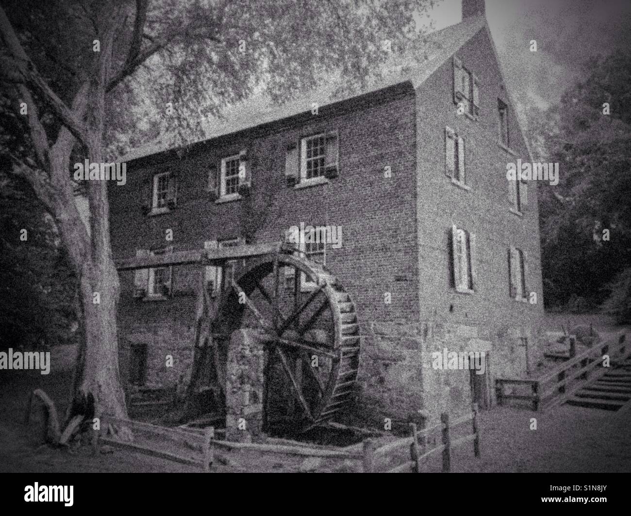 Black and white photo of historic mill and wheel at Millbridge North ...