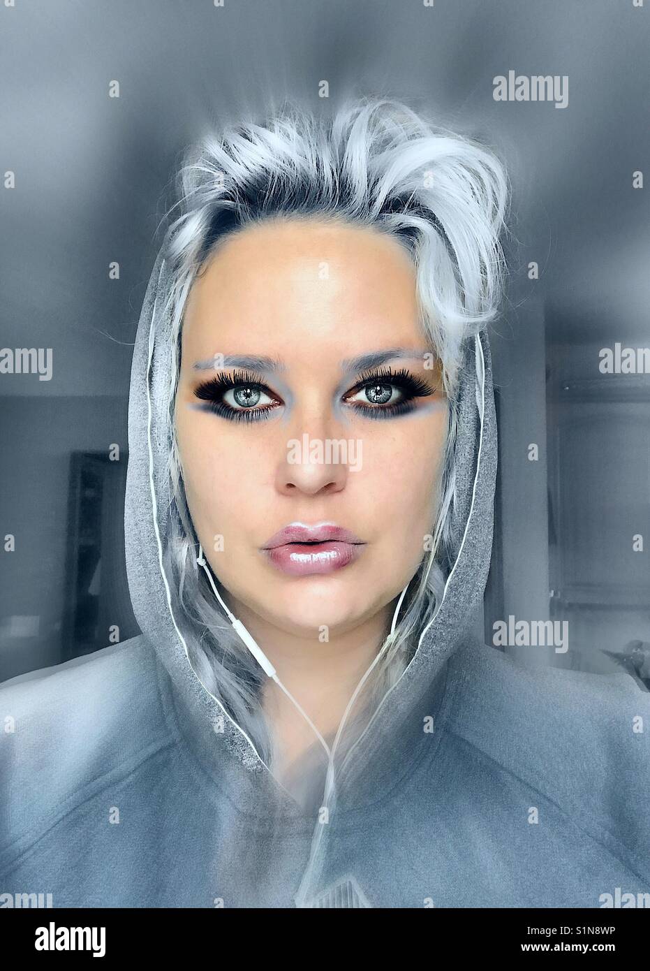 Portrait of woman in grey Stock Photo - Alamy