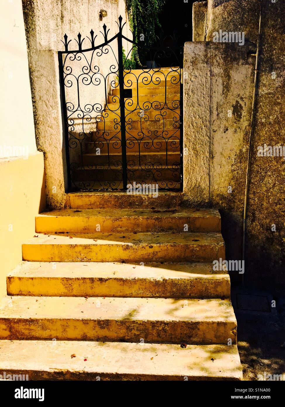 Stairs and traditional metalwork door in Ntomata on Kefalonia in Greece ...