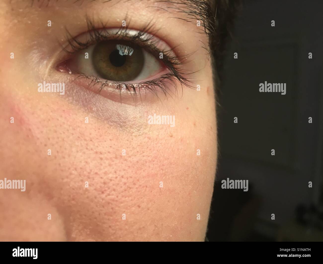 Half of man's face showing eye Stock Photo - Alamy