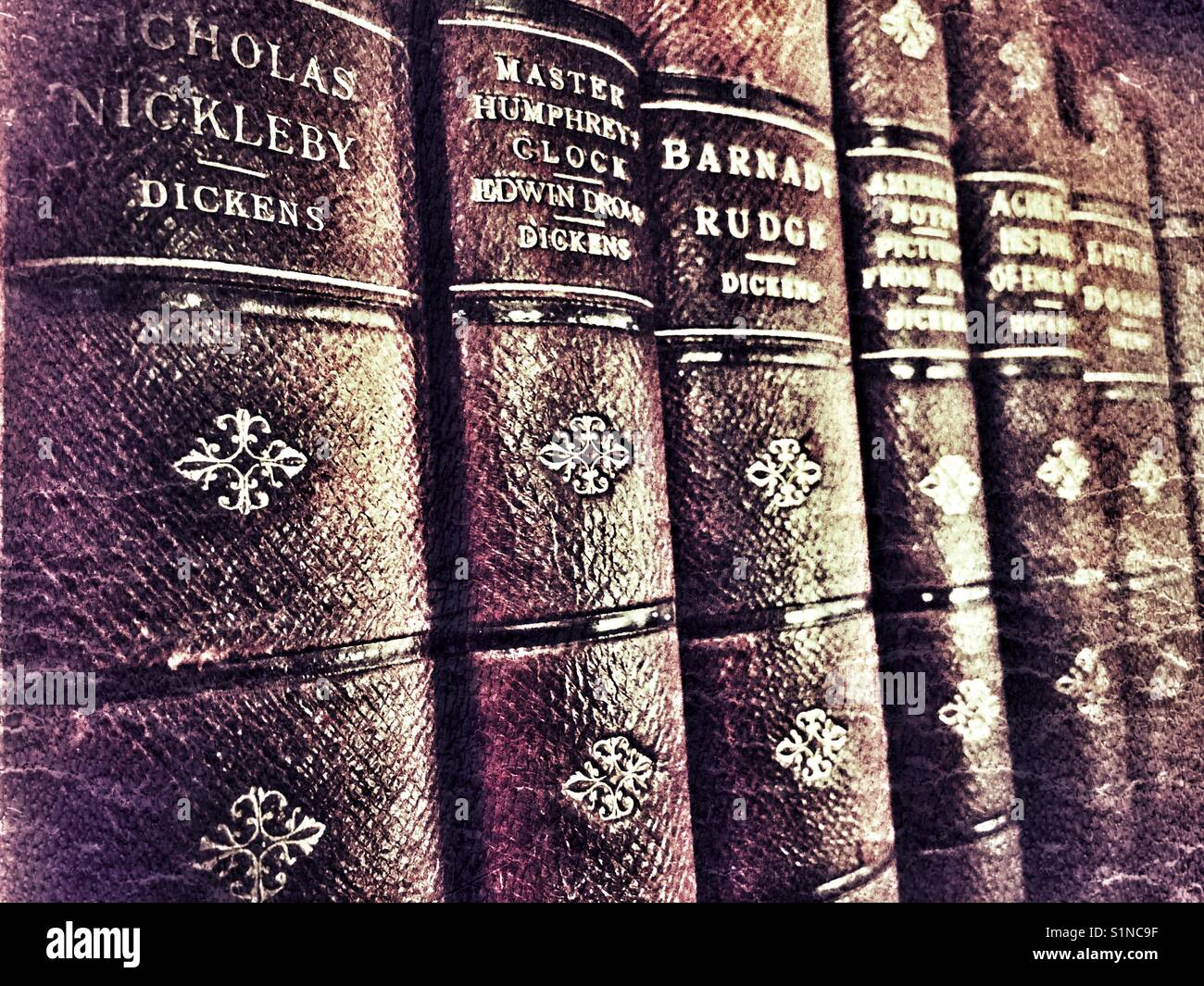 Antique books on a shelf in a bookcase Stock Photo - Alamy