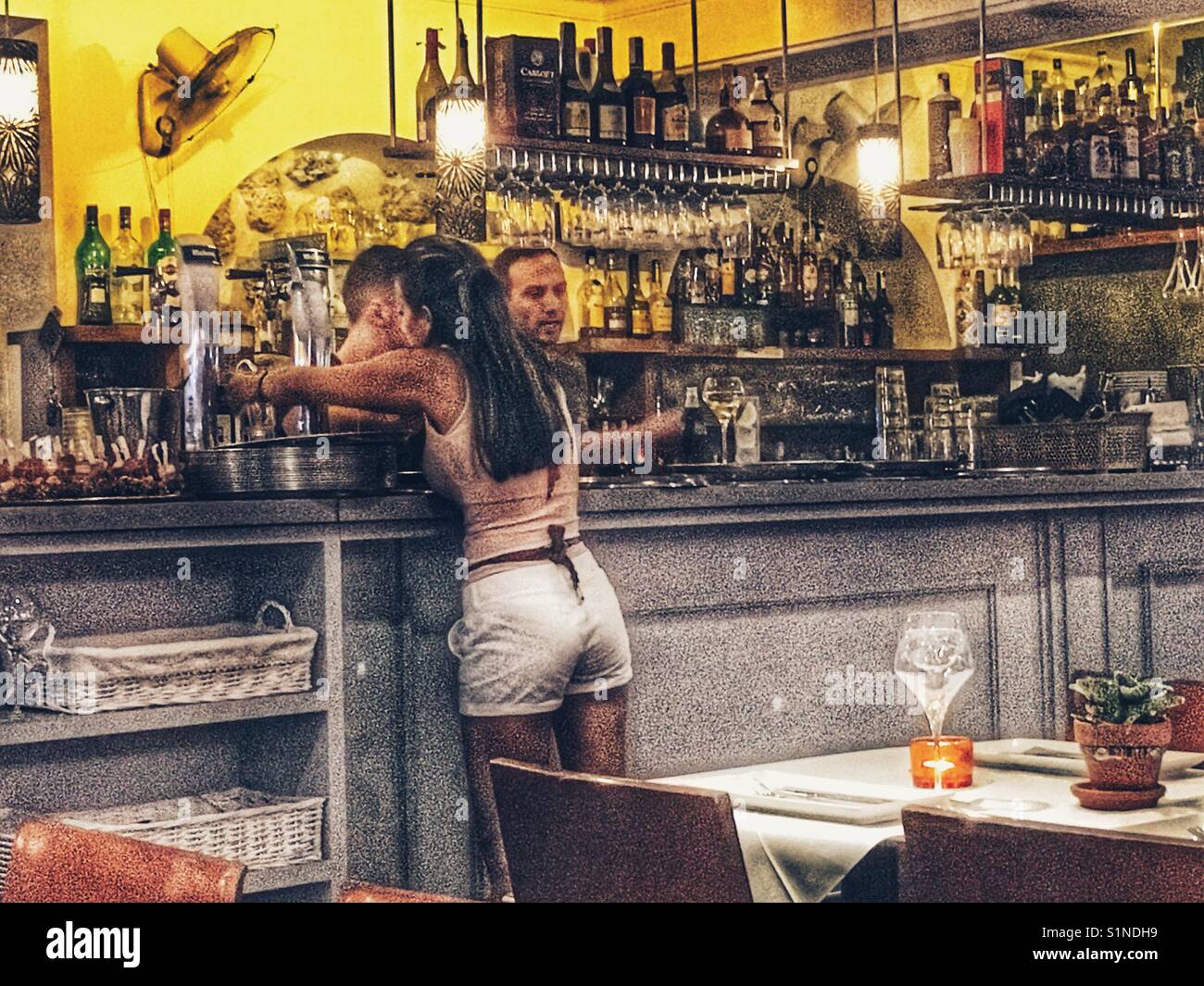 Restaurant interior - the bar area with barman and waitress Stock Photo ...