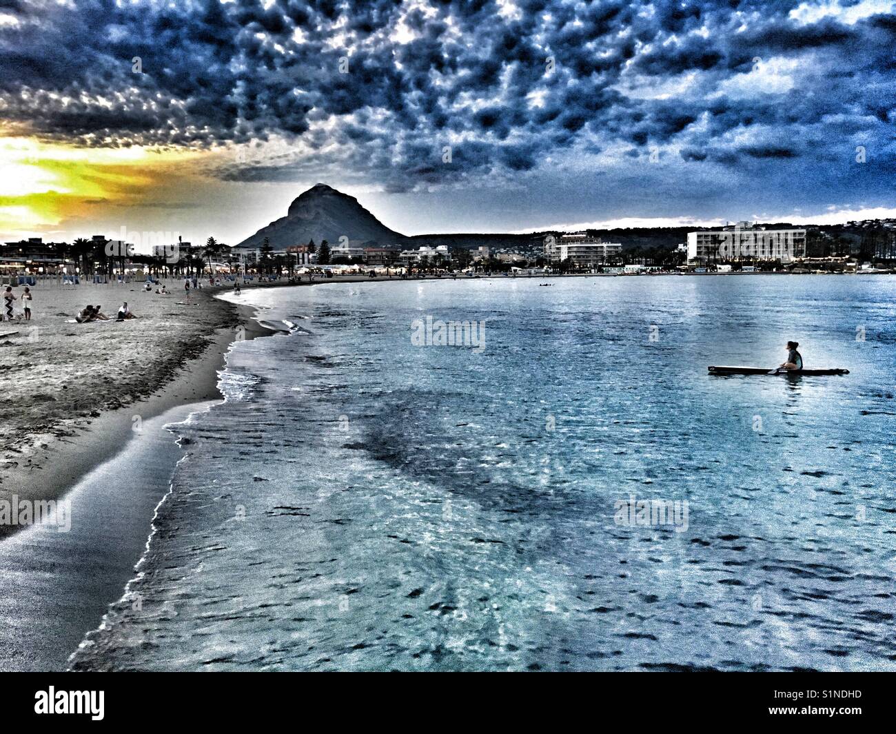 Sunset over the Arenal beach with canoeist and Montgo mountain behind ...