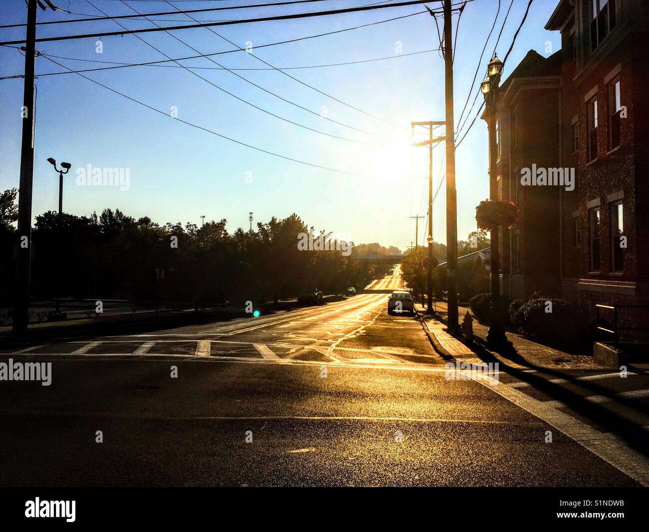 Street in a town in the morning Stock Photo - Alamy