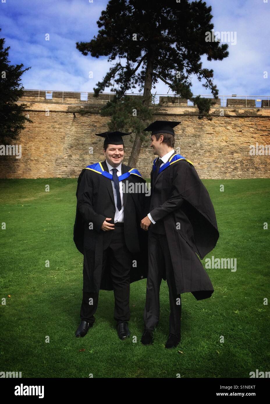 Graduates cap and gown hi-res stock photography and images - Alamy