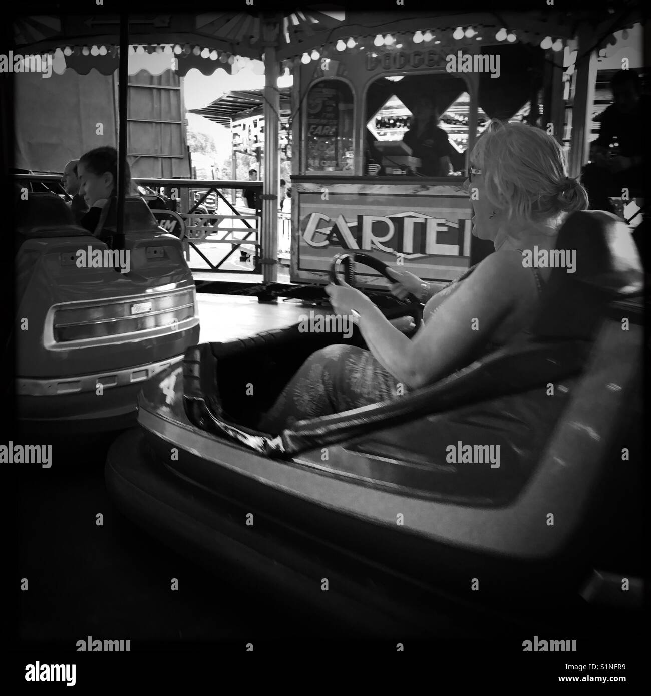 Woman in dodgem car Stock Photo - Alamy