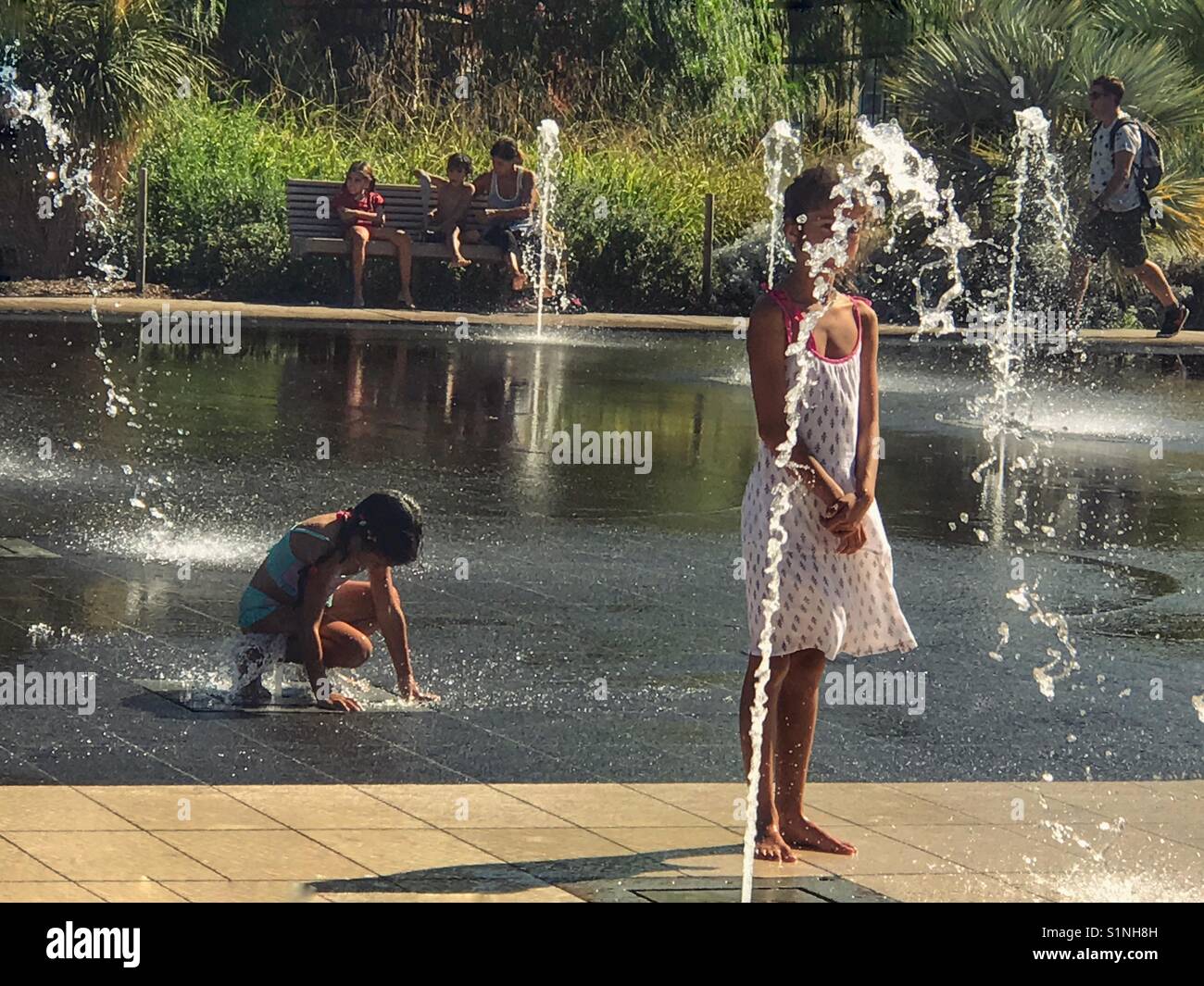 Children playing in a water park Stock Photo - Alamy