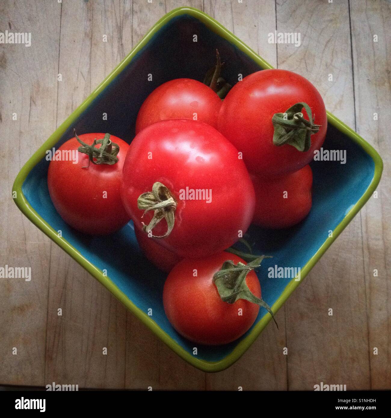 Round tomatoes square bowl hi-res stock photography and images - Alamy