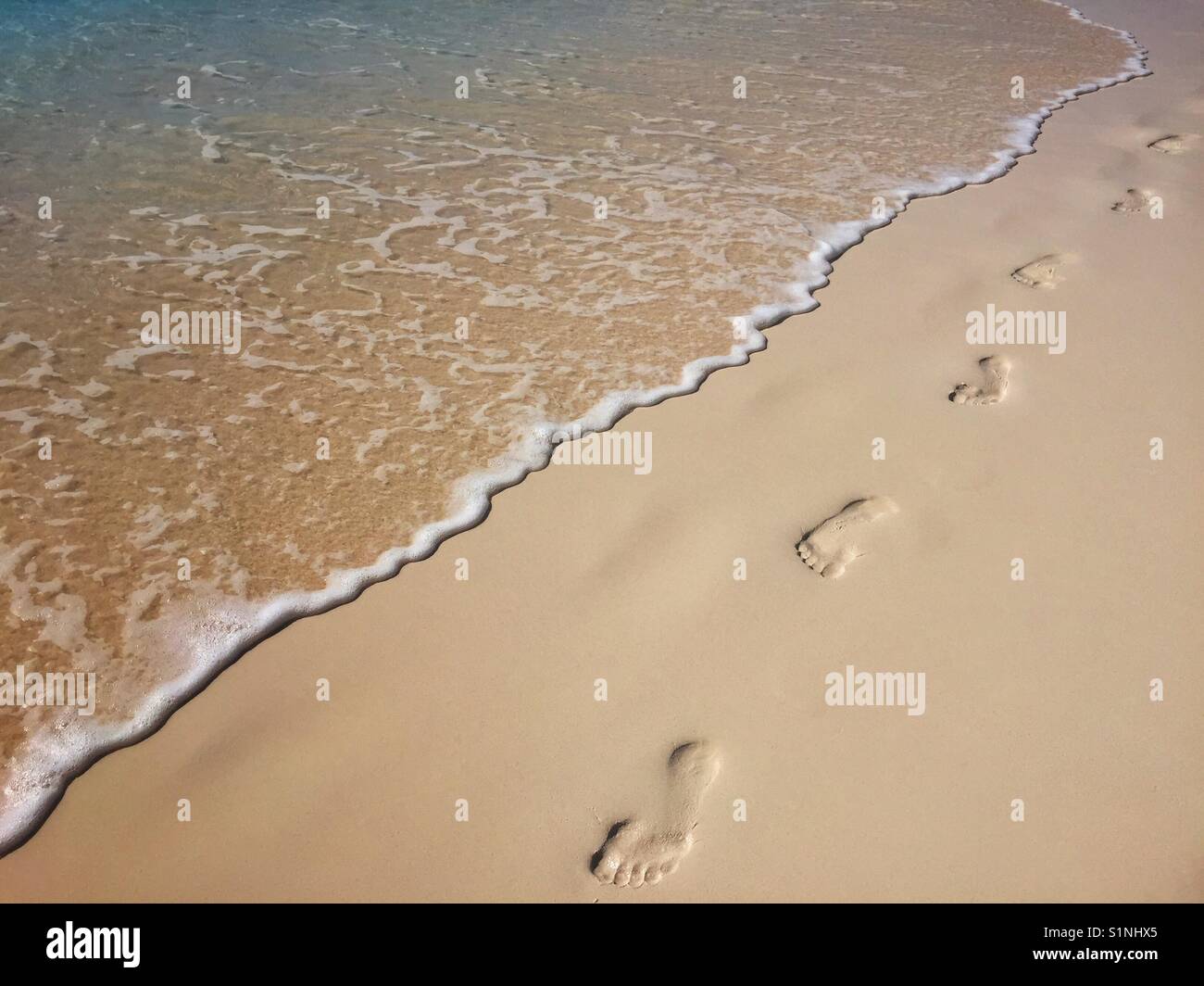 Feet beach waves hi-res stock photography and images - Alamy