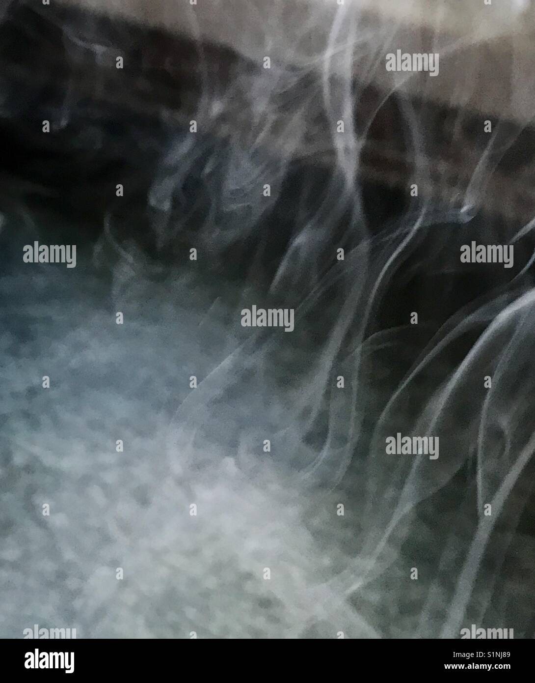 Smoke swirling around Stock Photo - Alamy