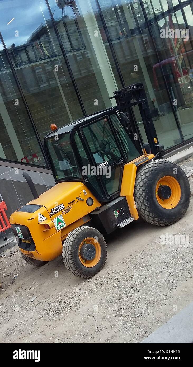 Little yellow JCB parked up ready for use at Westfield White City Stock ...