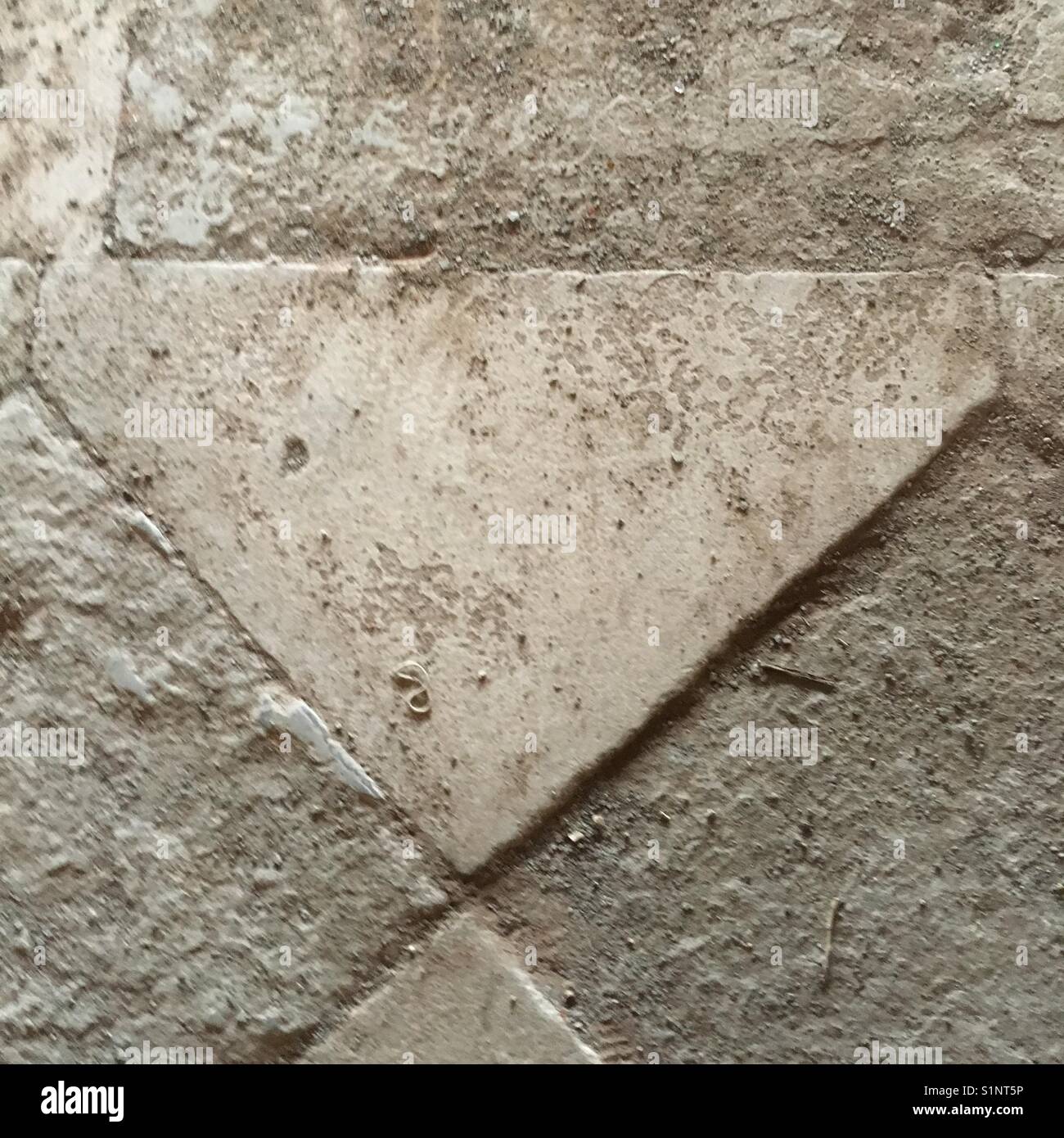 Triangle stone floor in pedestrian subway London Stock Photo - Alamy