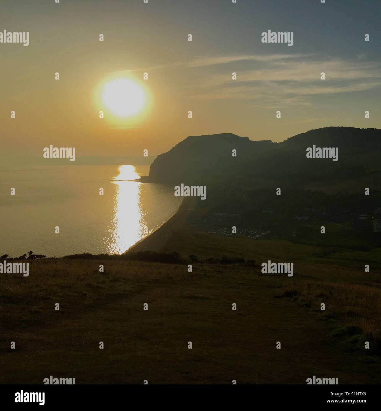 Sunset Over Sea Town Dorset England Stock Photo - Alamy