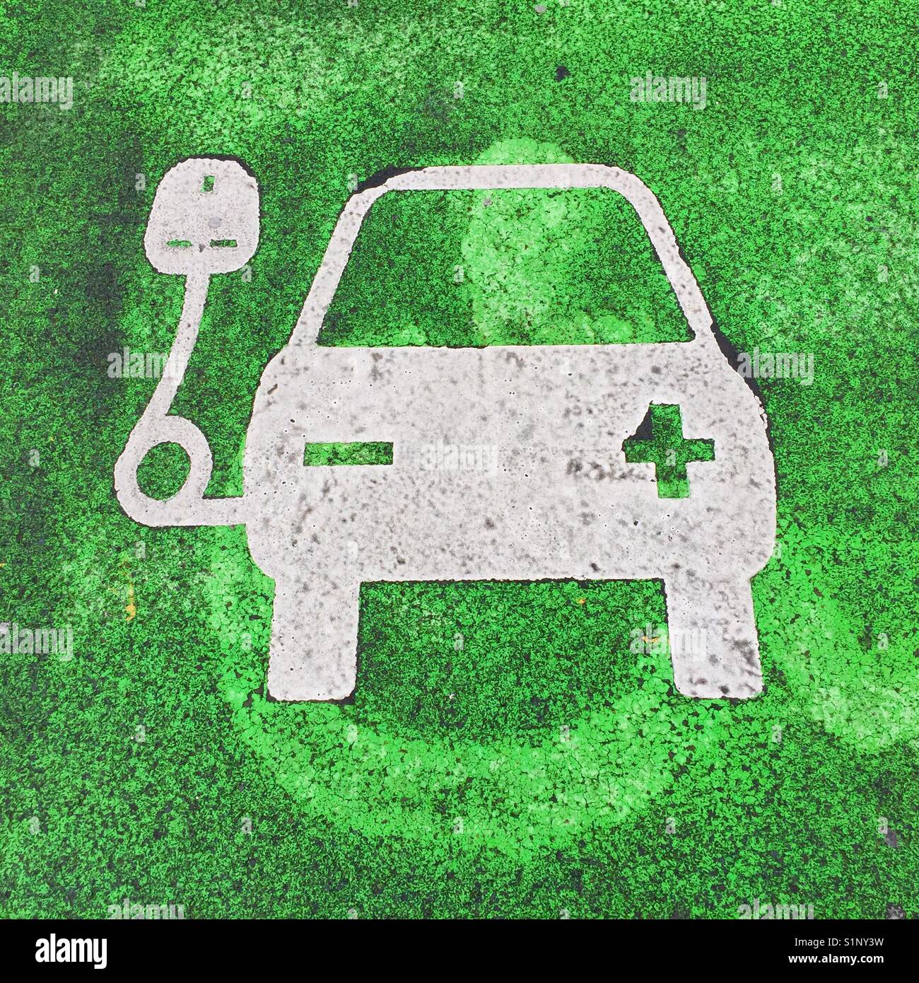 Sign painted on ground at electric car plug-in recharging station Stock ...