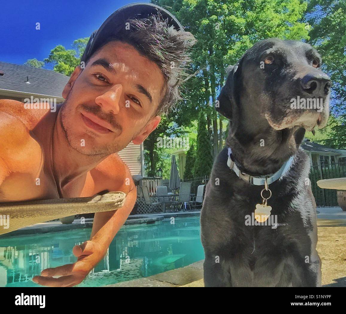 Black labrador and man hi-res stock photography and images - Alamy