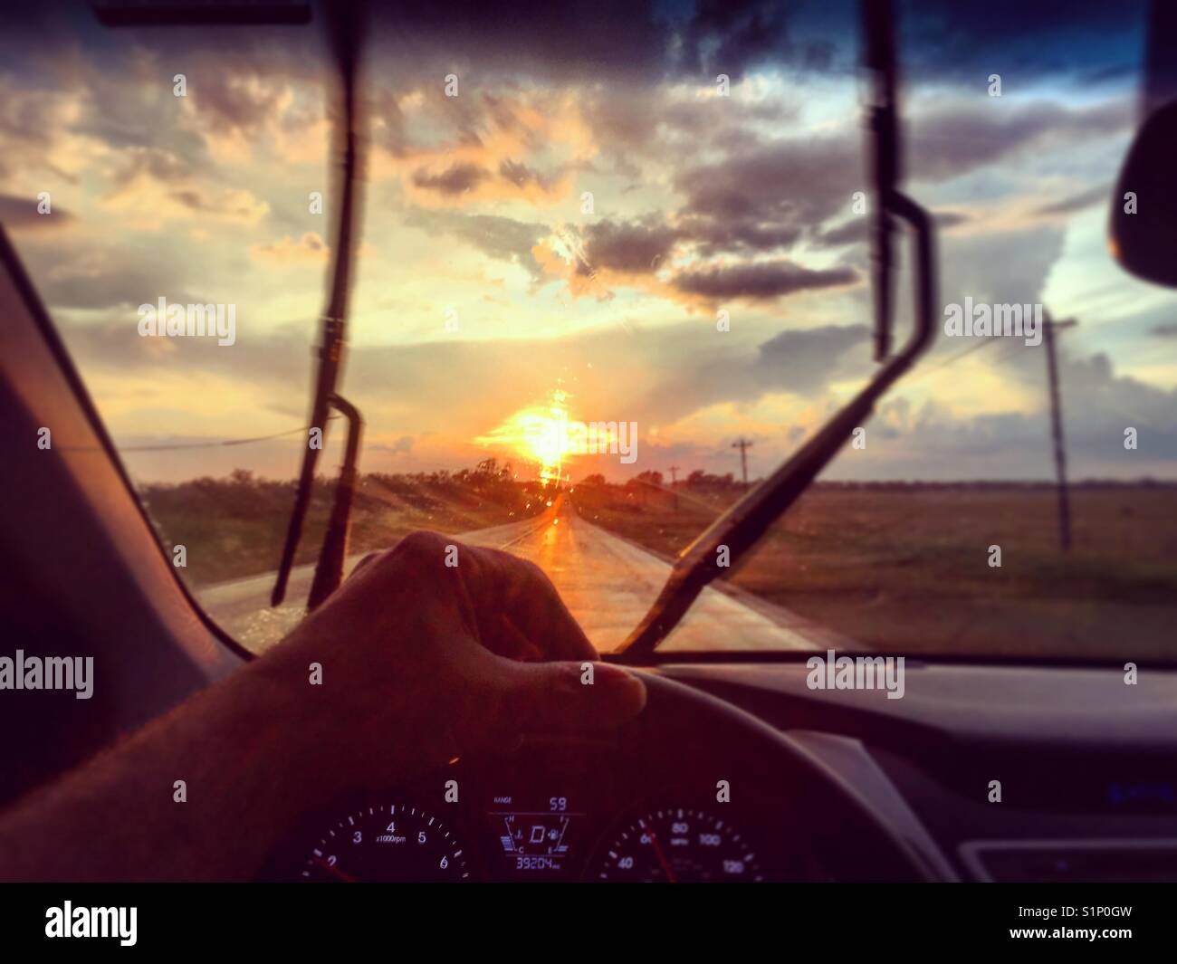 Driving into the sunset hi-res stock photography and images - Alamy