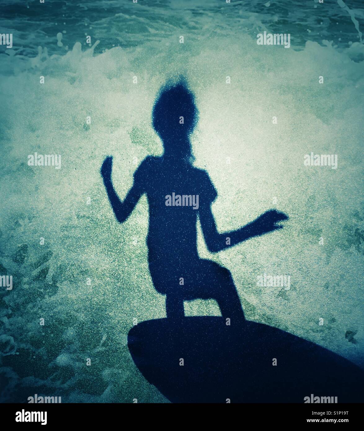 Girl surfing waves hi-res stock photography and images - Alamy