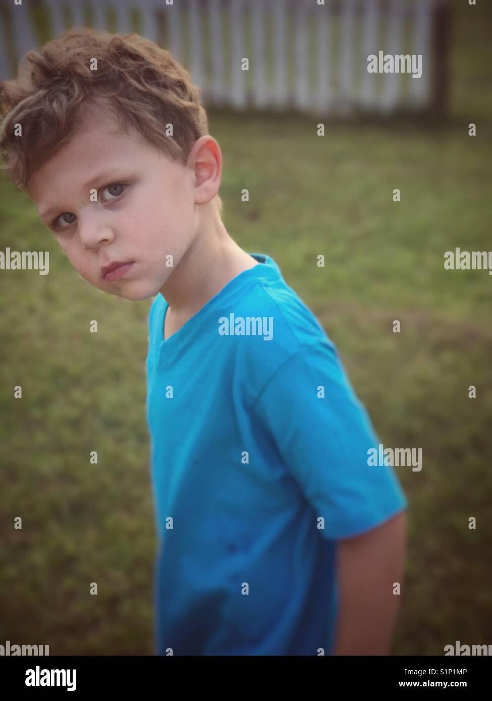 Kid with blue shirt hi-res stock photography and images - Alamy