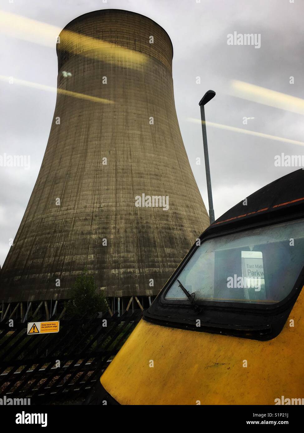 Power station and train Stock Photo - Alamy