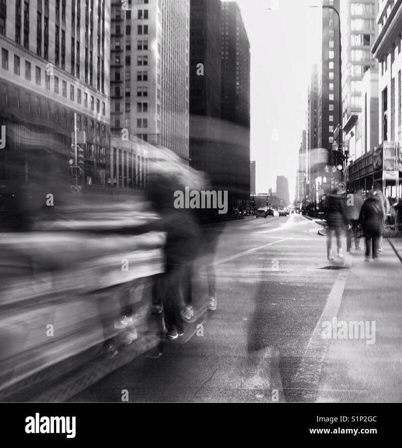 People walking in intersection Stock Photo - Alamy