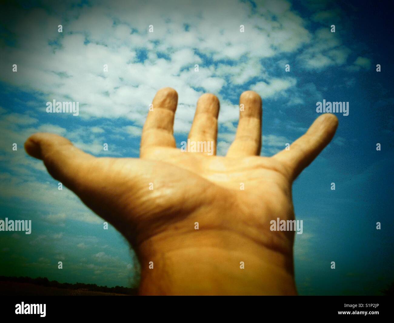 Hand open to Sky Stock Photo - Alamy