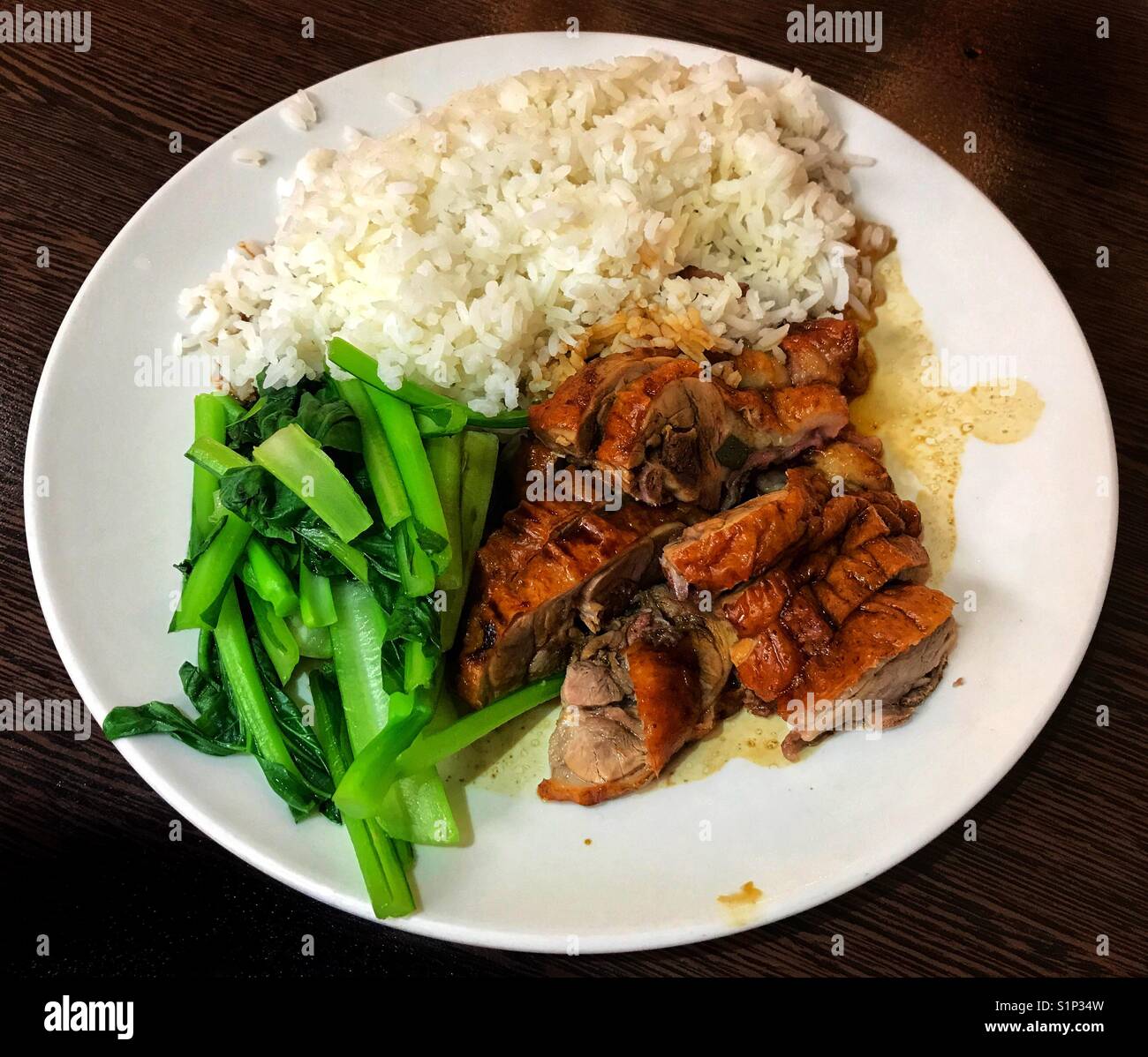 Cantonese roast duck with rice and vegetables Stock Photo - Alamy