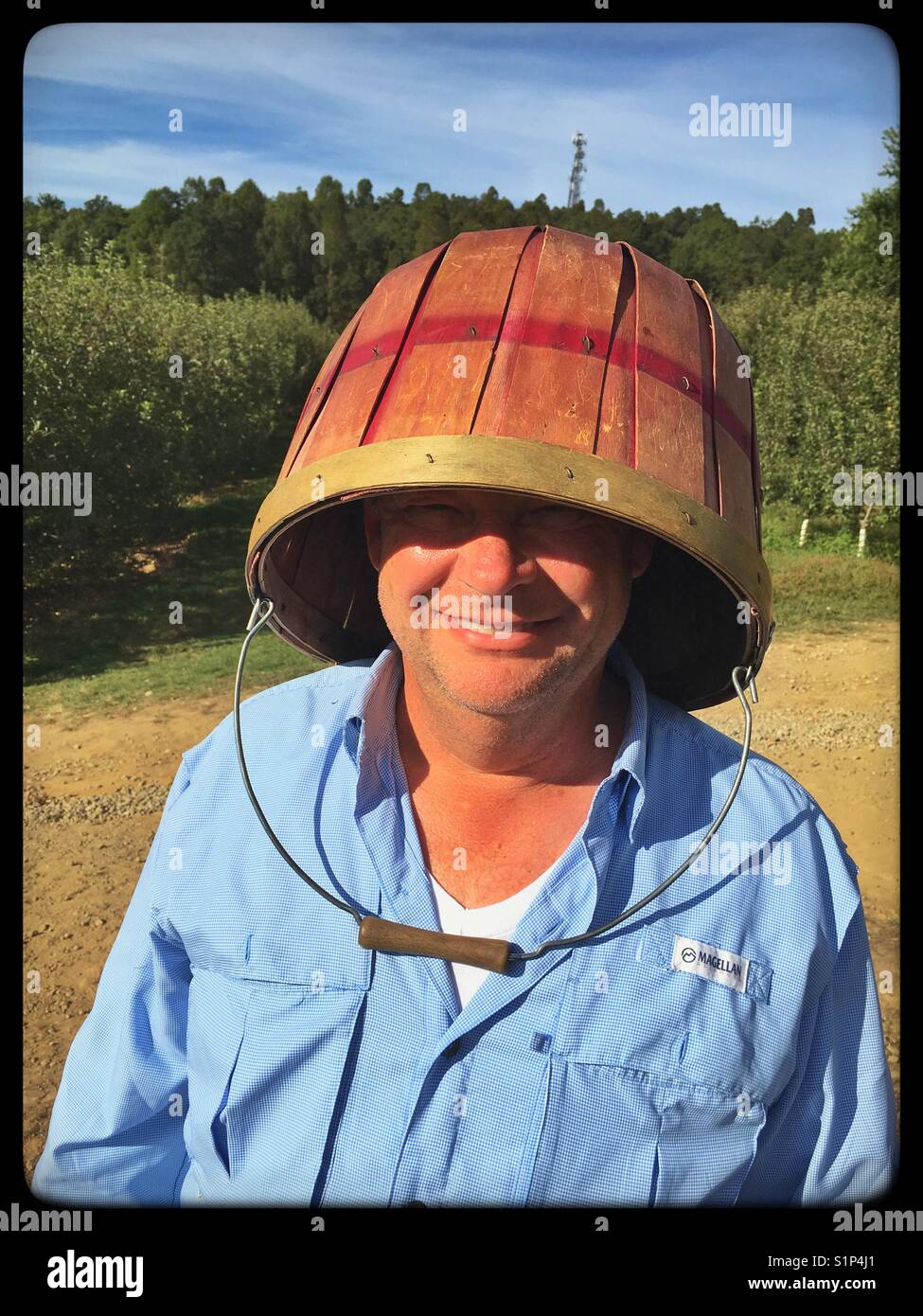 Man with basket on his head Stock Photo - Alamy