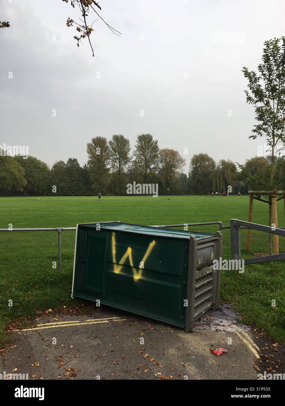 Upturn ports loo in a public park with graffiti Stock Photo - Alamy