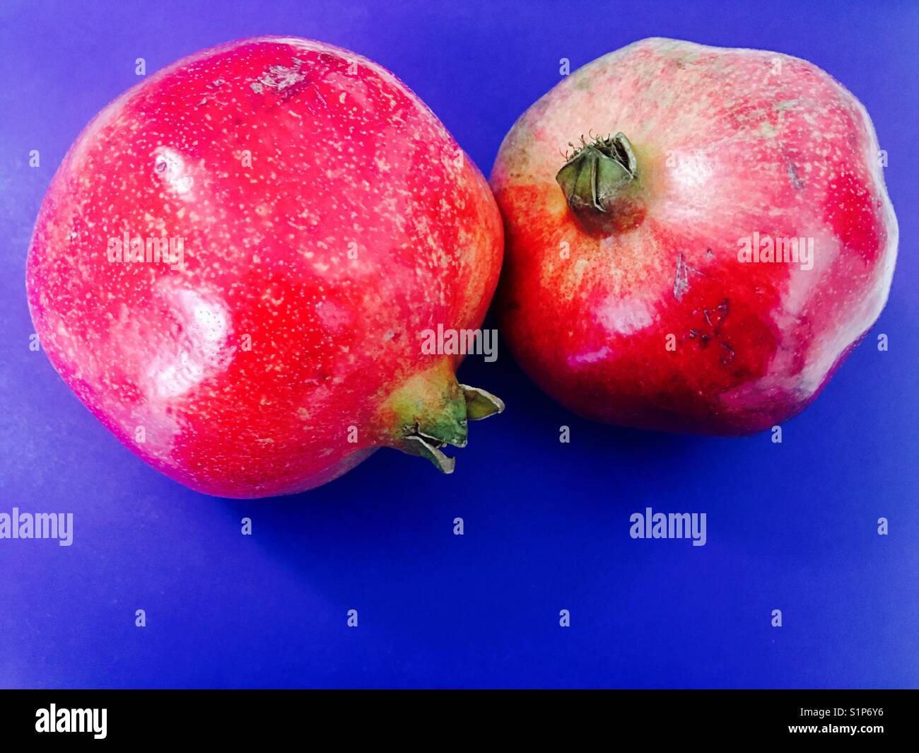 Two whole pomegranates hi-res stock photography and images - Alamy