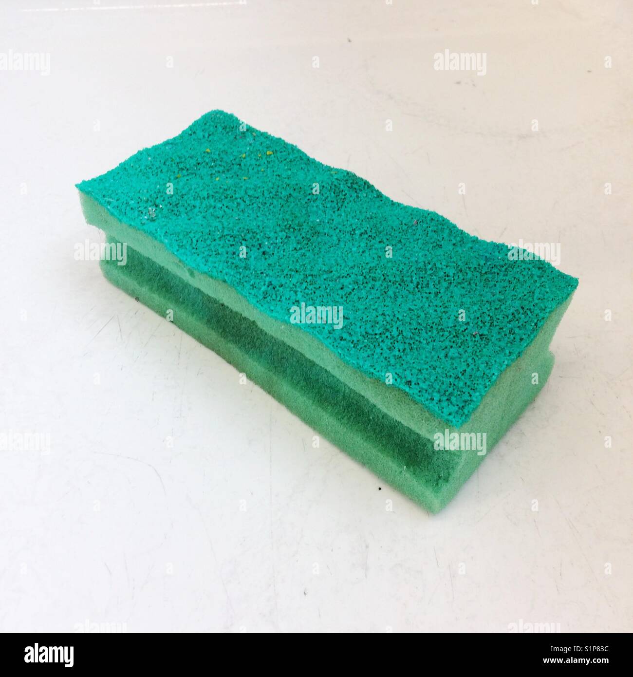 Used kitchen scouring sponge Stock Photo - Alamy