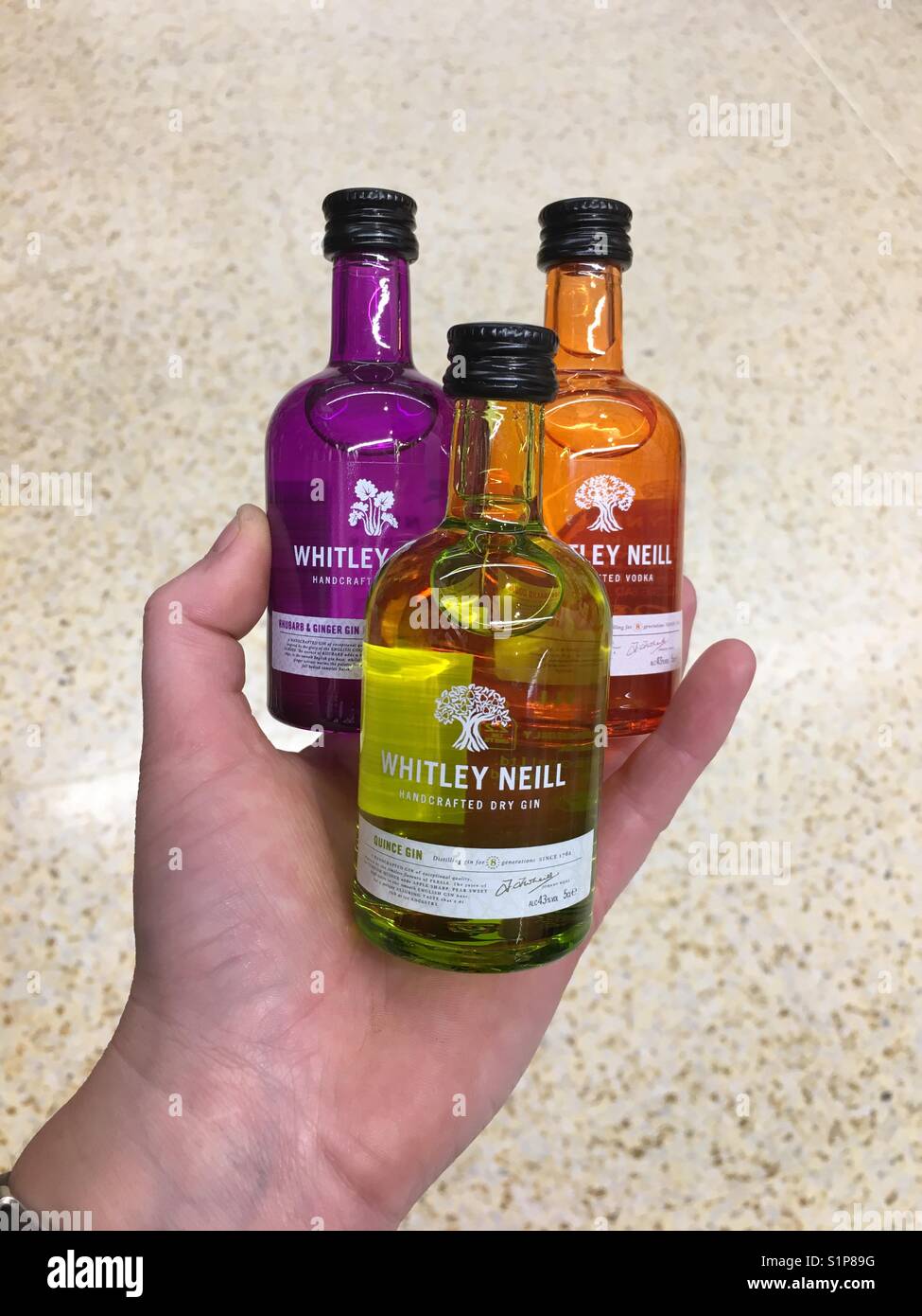Miniature Glass Bottles Of Flavoured Whitley Neill Gin In A Human Hand ...