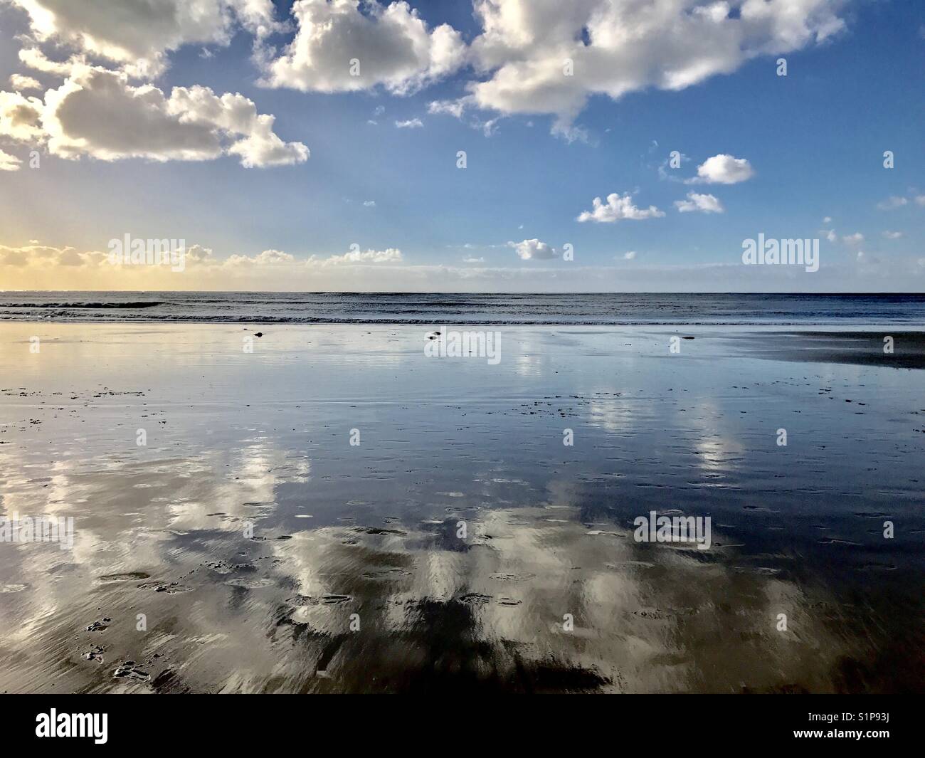 Reflection on the beach Stock Photo - Alamy