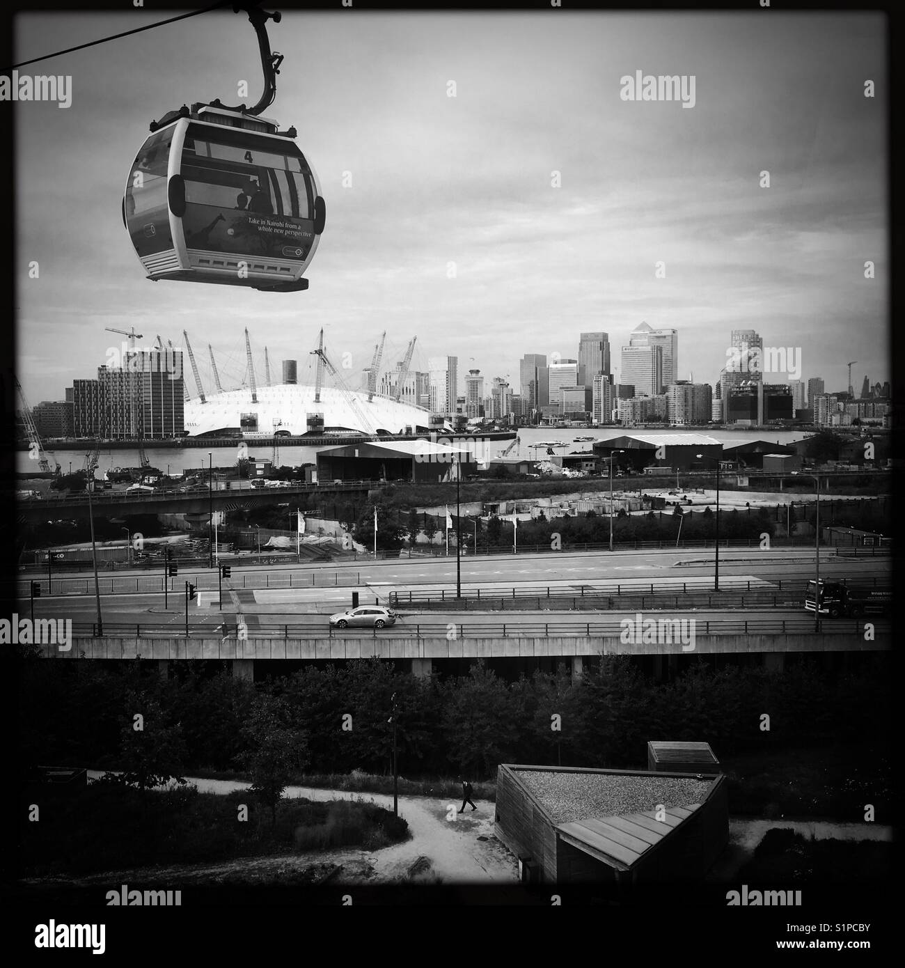 Emirates Air Line Cable car and the o2 with Canary Wharf in the ...