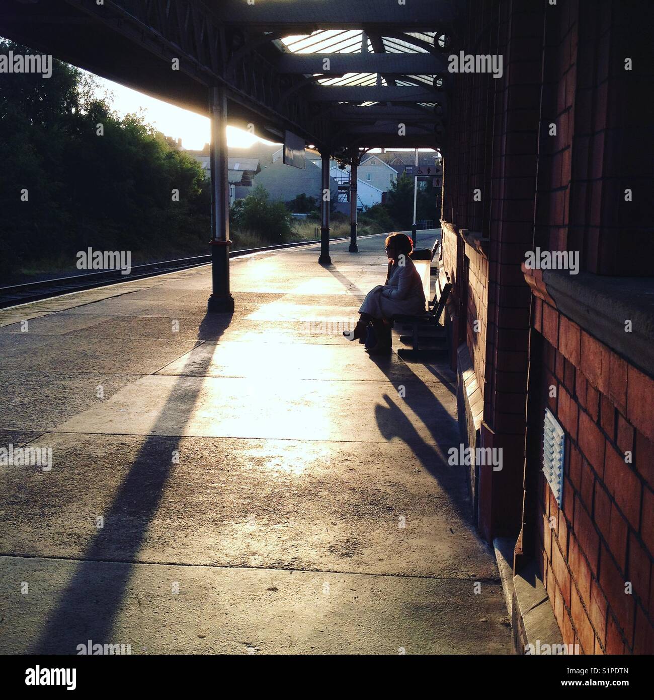 Waiting for morning train Stock Photo - Alamy