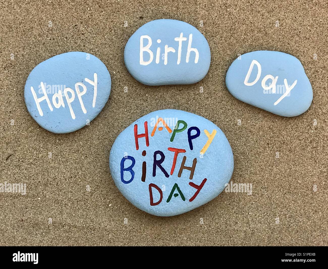 Happy Birthday stones over beach sand Stock Photo - Alamy