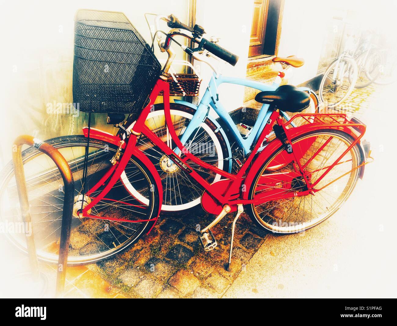 Red and blue bicycles Stock Photo - Alamy