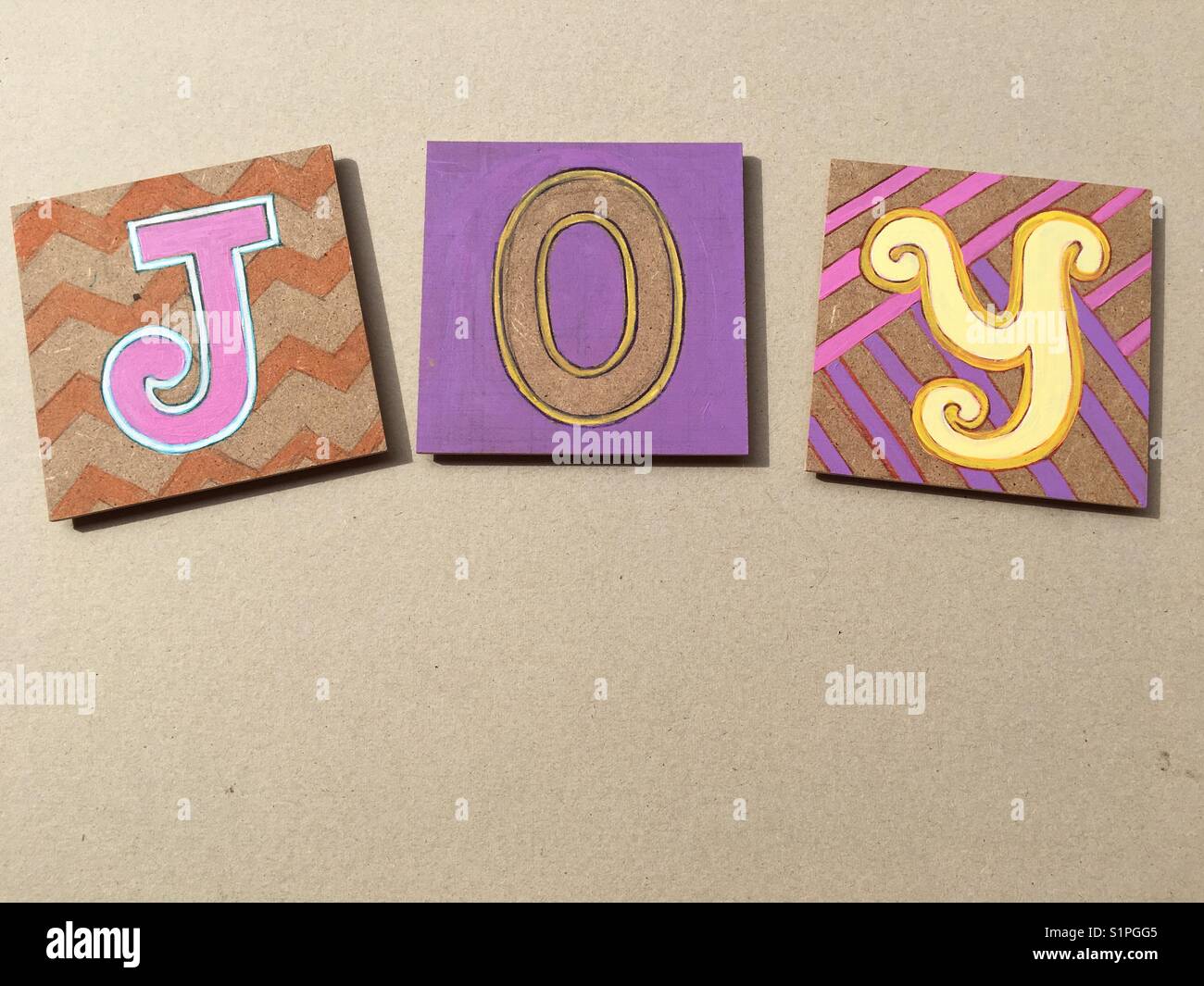 Joy in hand painted letters Stock Photo - Alamy