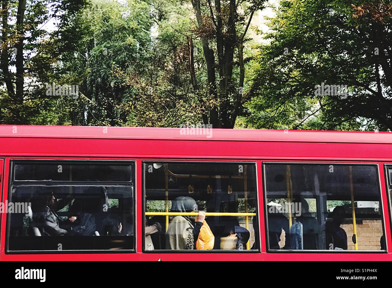 Passengers red london bus hi-res stock photography and images - Alamy