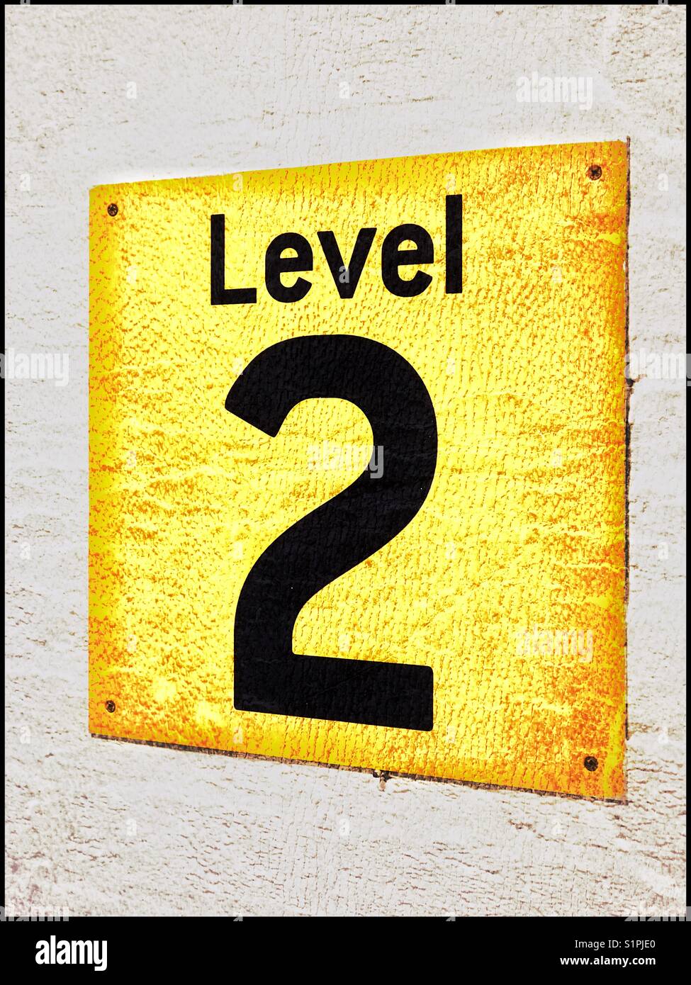 A grunge effect picture of a multi-storey car park wall sign. This is ...